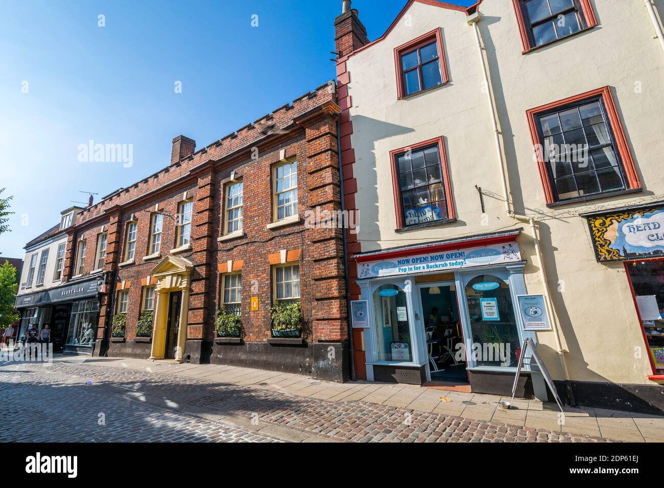 View of shops on Pottergate in summer, Norfolk, England, United Kingdom ...