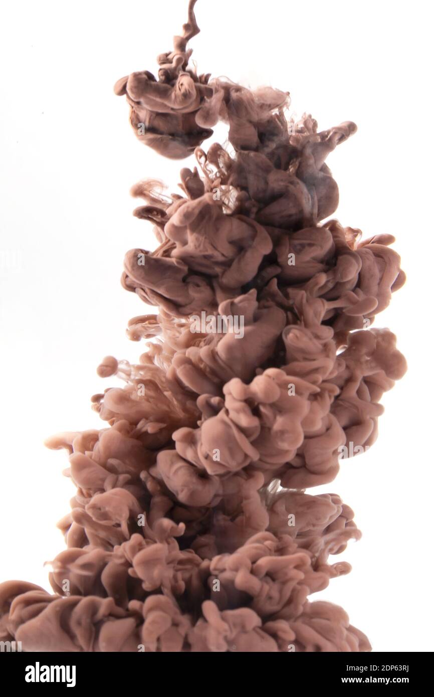 A vertical shot of chestnut brown ink in the water Stock Photo - Alamy
