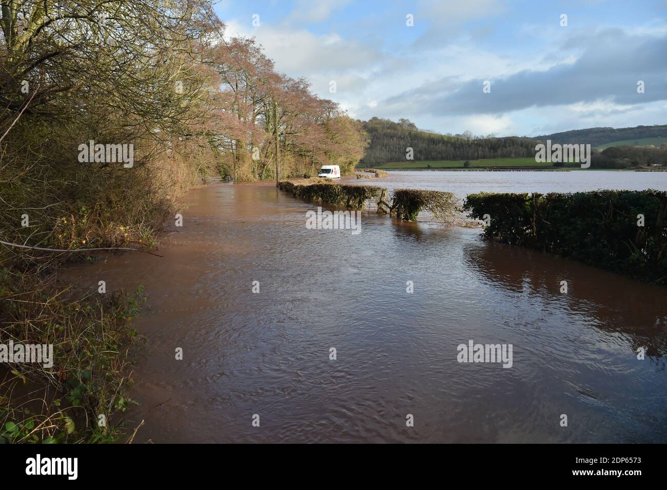 A DPD delivery van stranded in flood water waits for emergency services ...