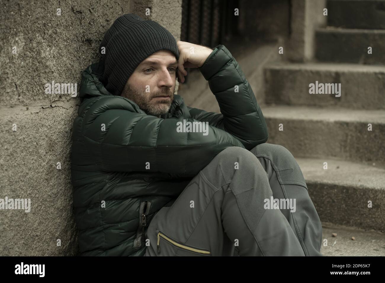 dark and edgy urban portrait of middle aged sad and depressed ...