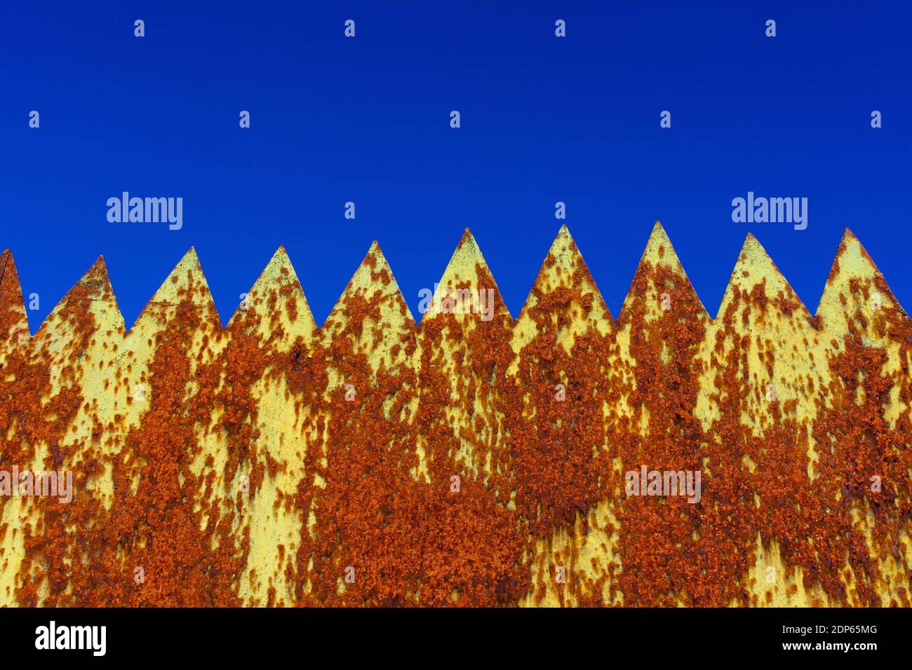 A closeup shot of a rusty texture under a blue sky Stock Photo - Alamy