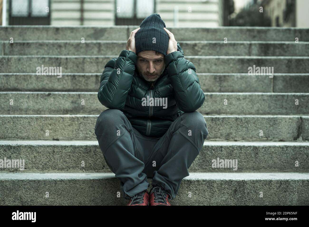 dark and edgy urban portrait of middle aged sad and depressed ...