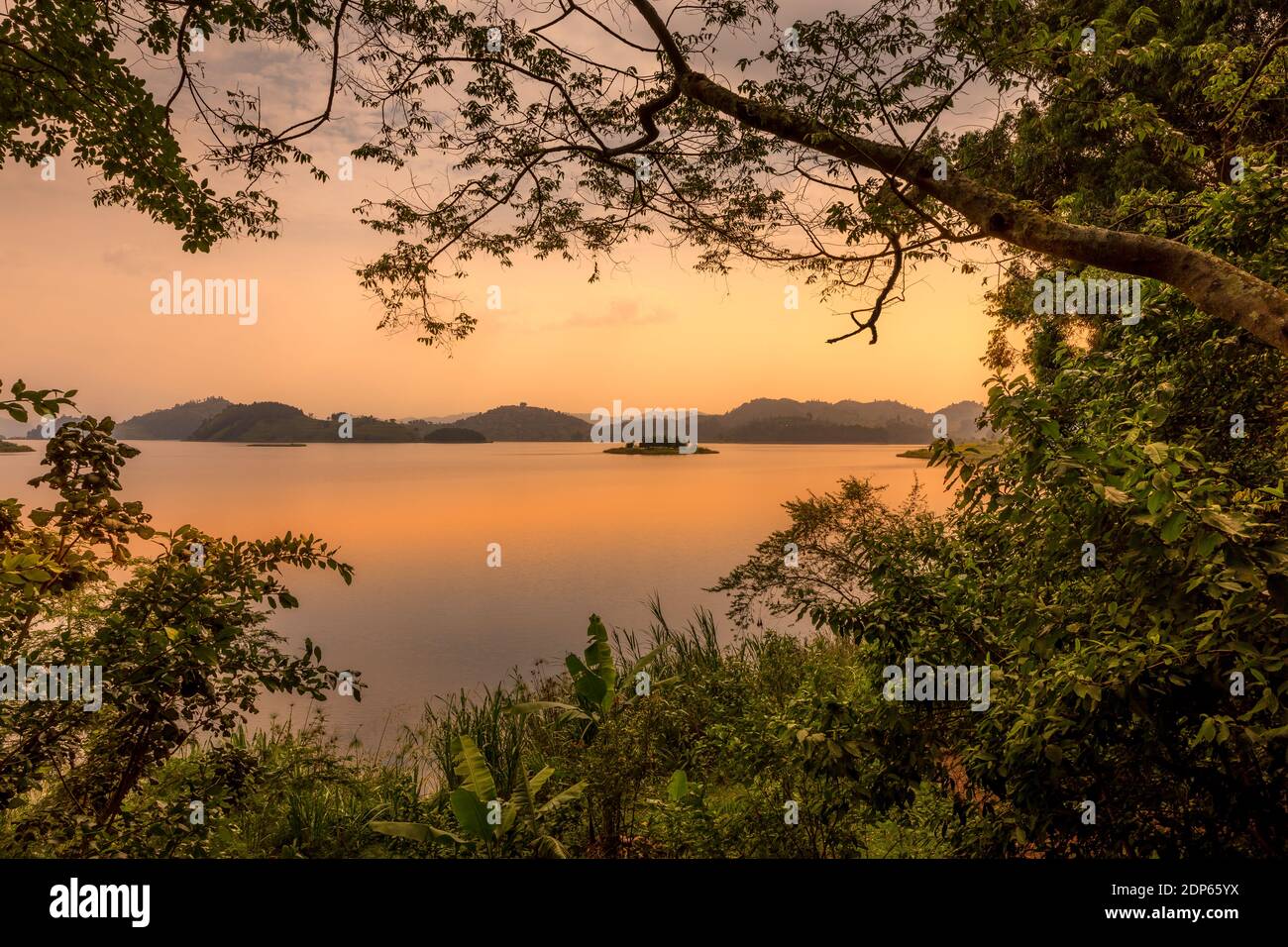 Lake Mutanda at sunset with view on the volcanoes mount Muhavuru and ...