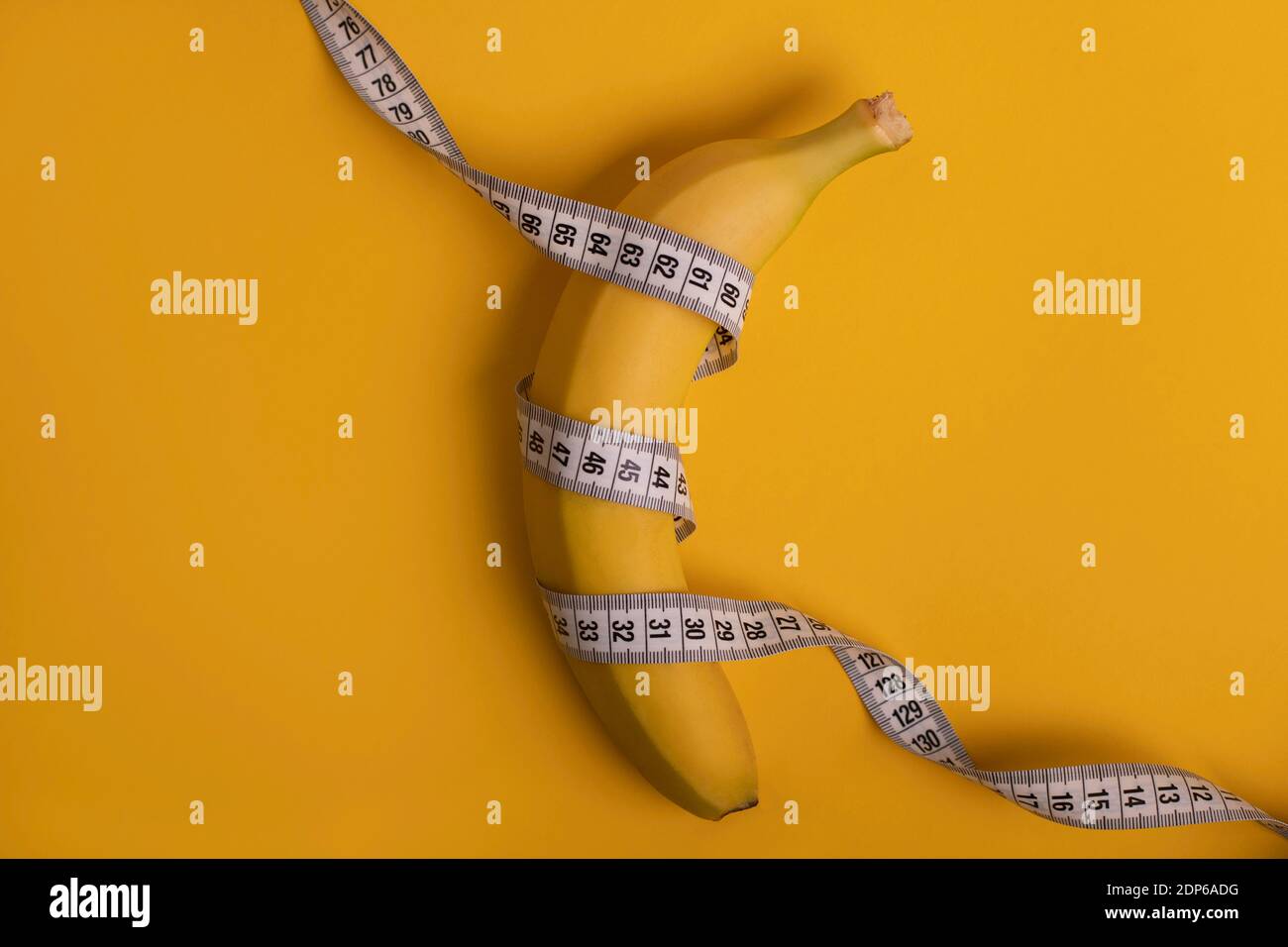 banana is on diet, measuring tape Stock Photo - Alamy