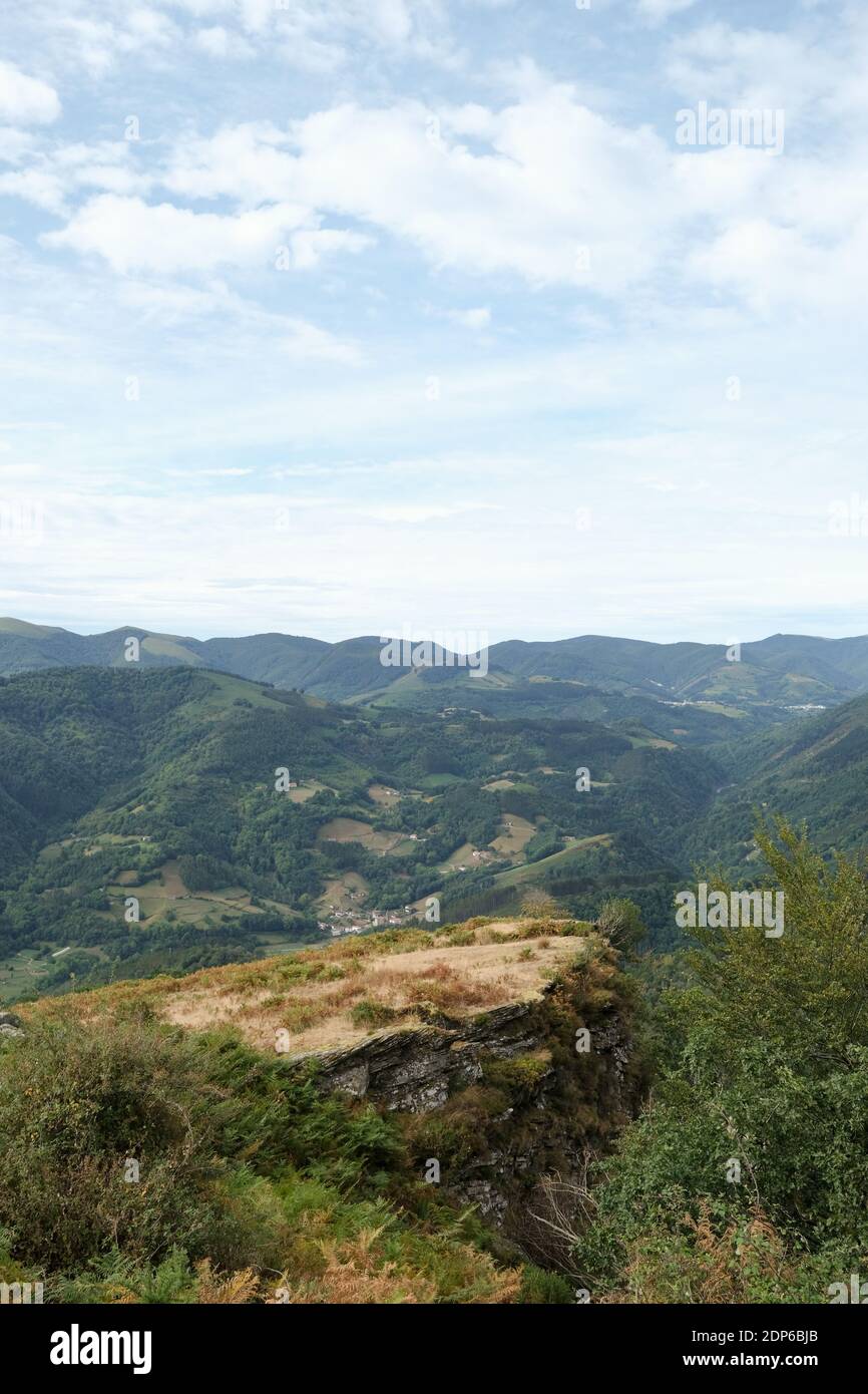 A vertical shot of the beautiful tree-covered valleys and hills Stock ...