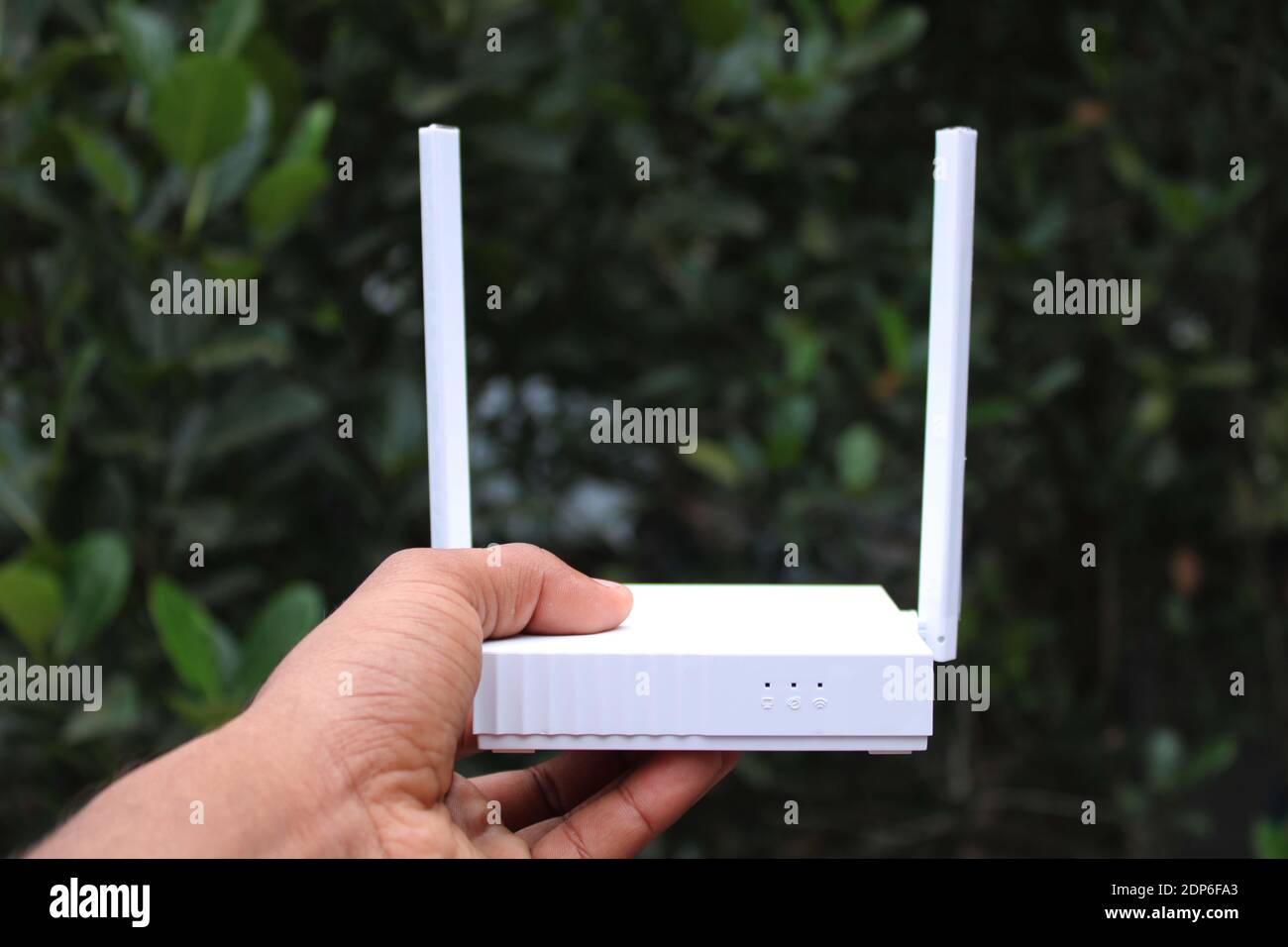 White color WiFi Router on hand photo capture at Dhaka, Bangladesh ...