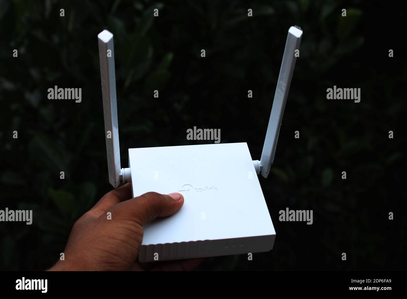 White color WiFi Router on hand photo capture at Dhaka, Bangladesh ...