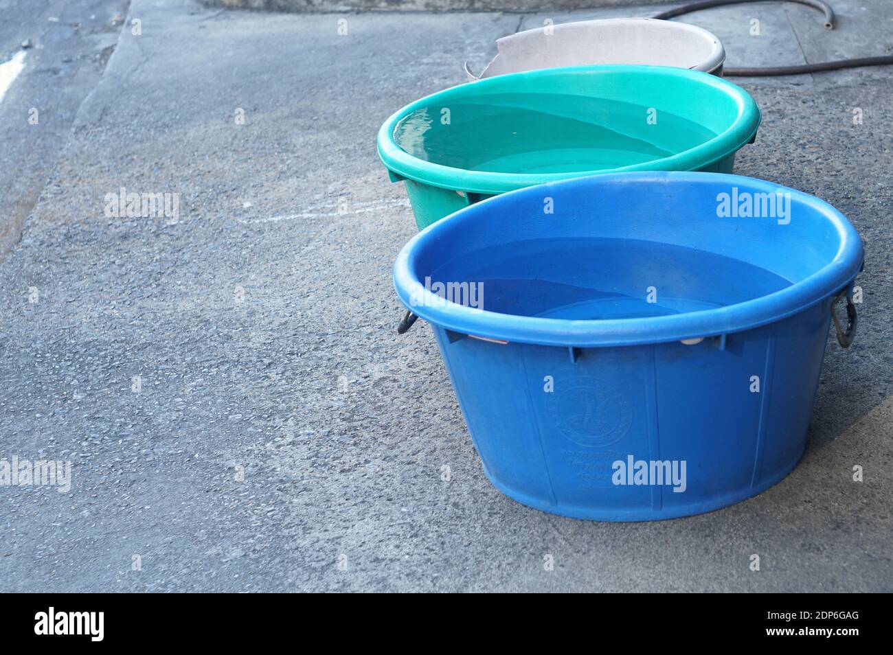 Preparing a water storage in a basin beside a street Stock Photo - Alamy