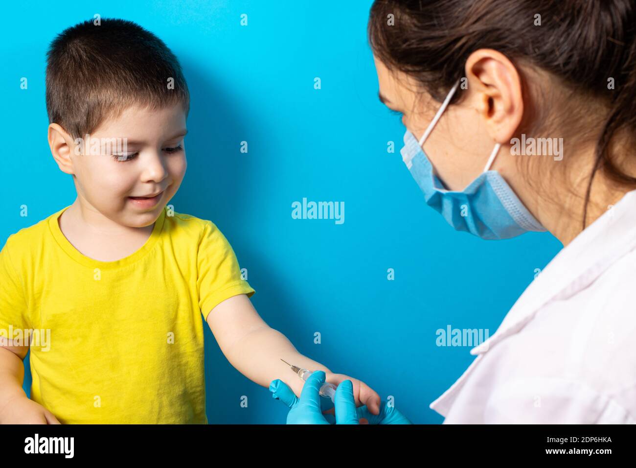 A doctor or nurse does a Mantoux test for a small baby boy ...