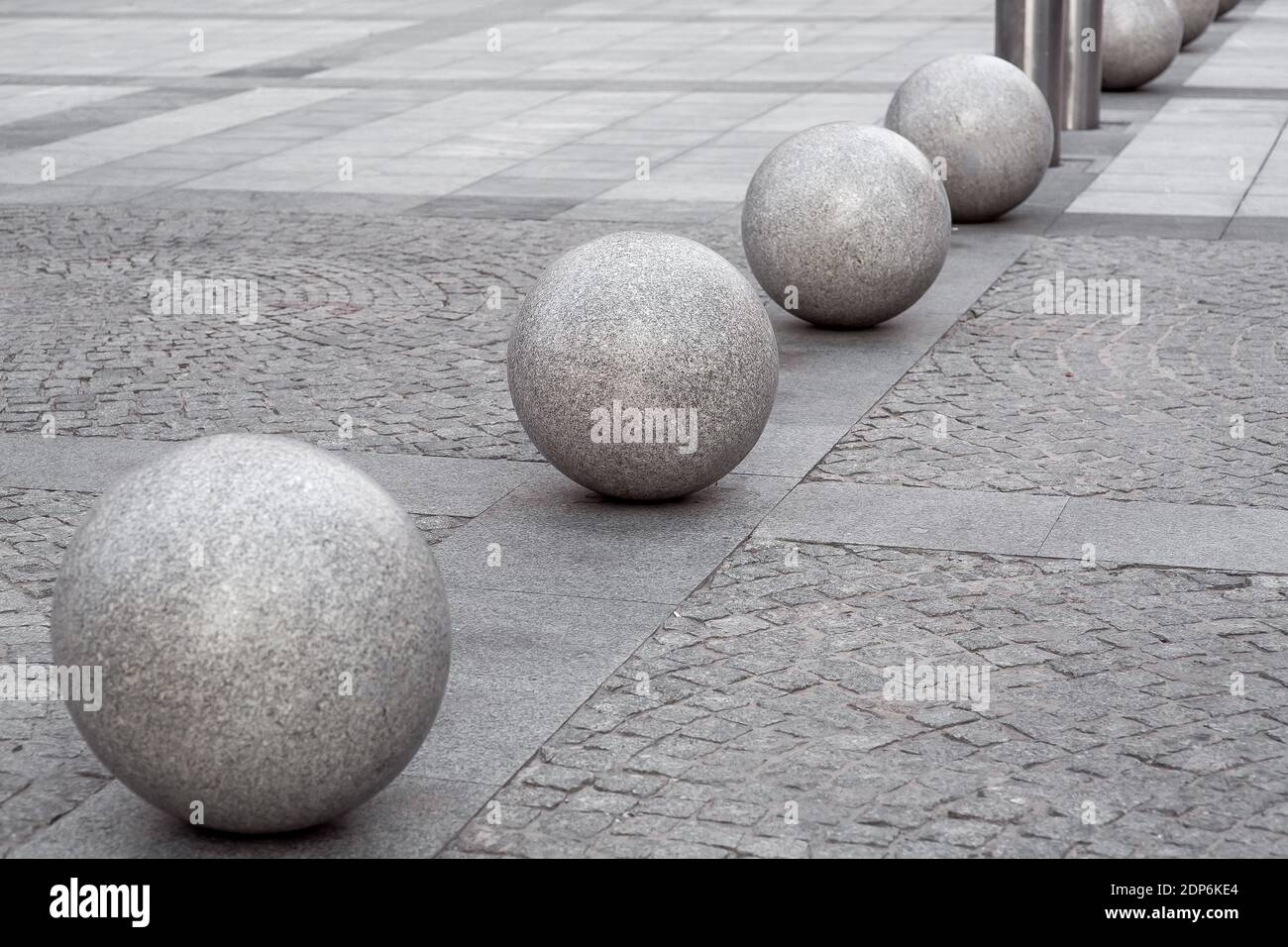 row of glossy granite balls decorative traffic barrier on the ...