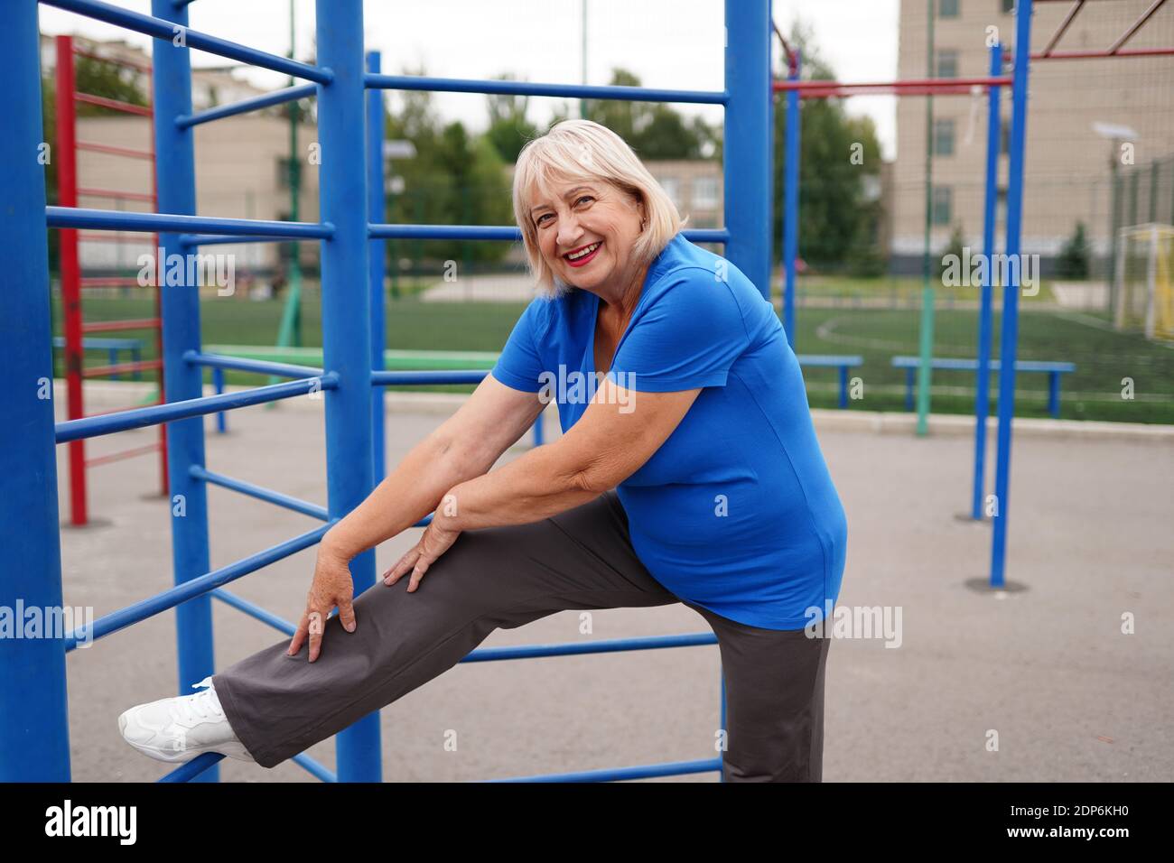 beautiful healthy woman 64 years old doing exercises outdoors Stock ...