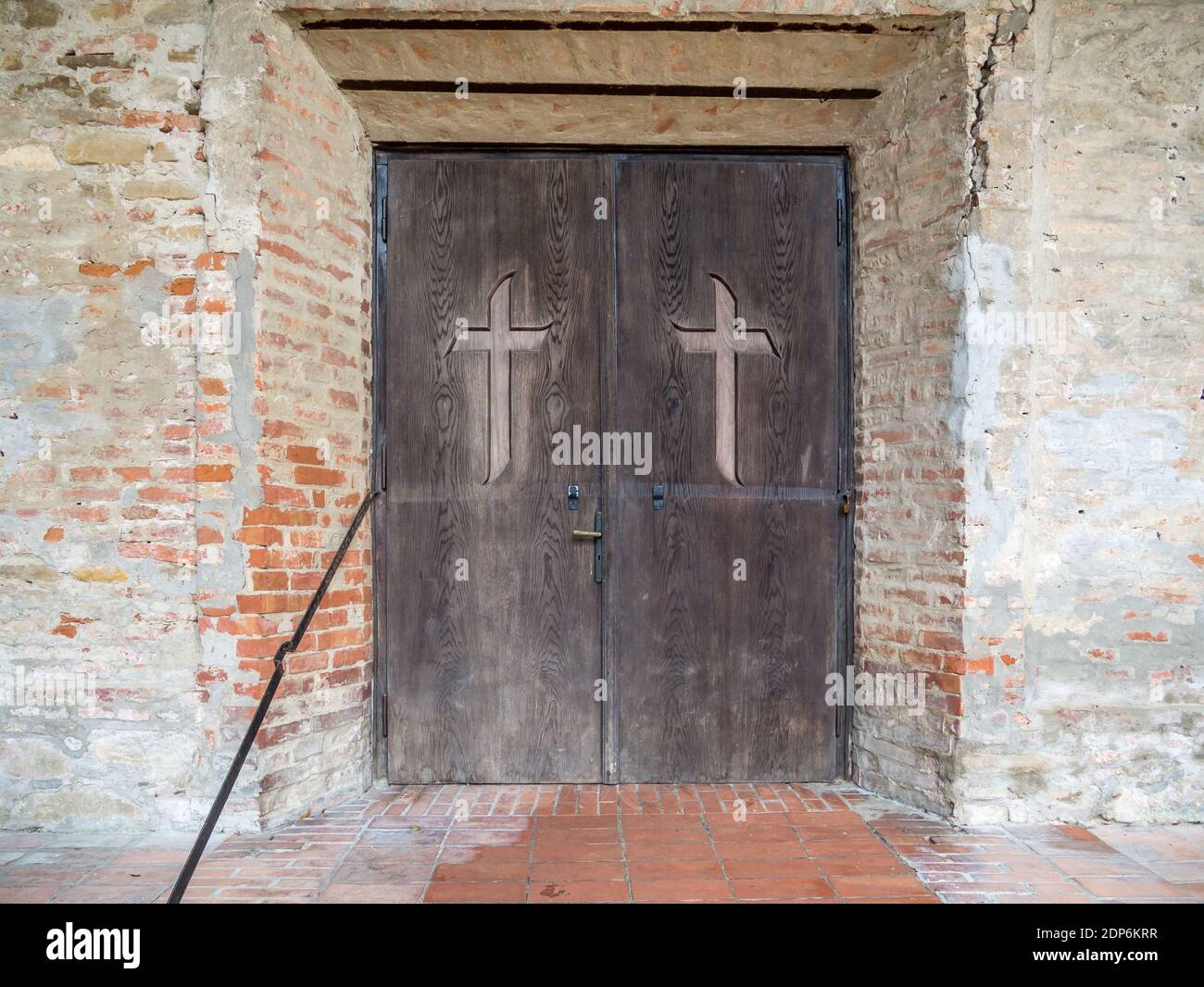Christian cross carved in a wooden door Stock Photo - Alamy