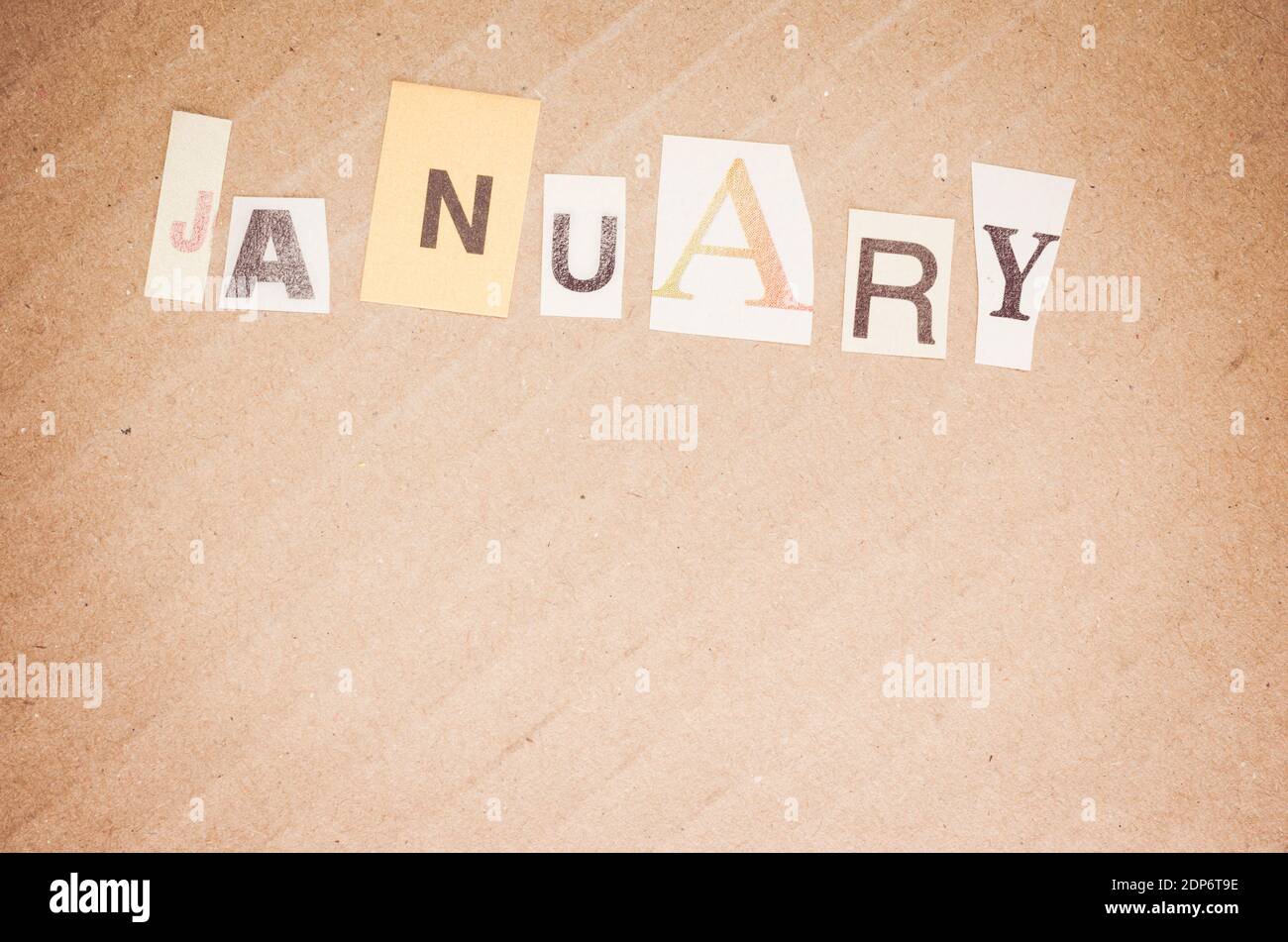A 'January' month name on a paperboard background Stock Photo - Alamy