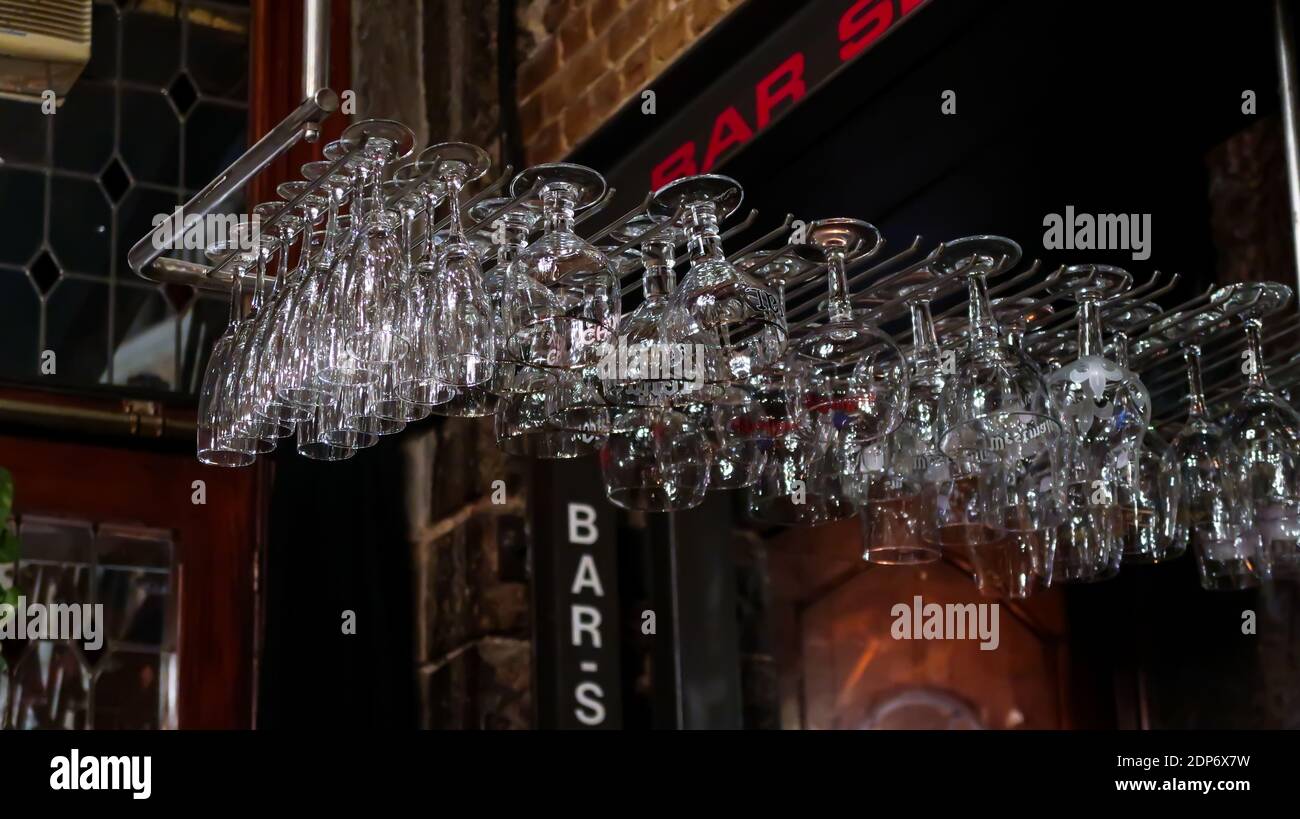 A low angle shot of stacked glasses for drinks in a bar Stock Photo - Alamy