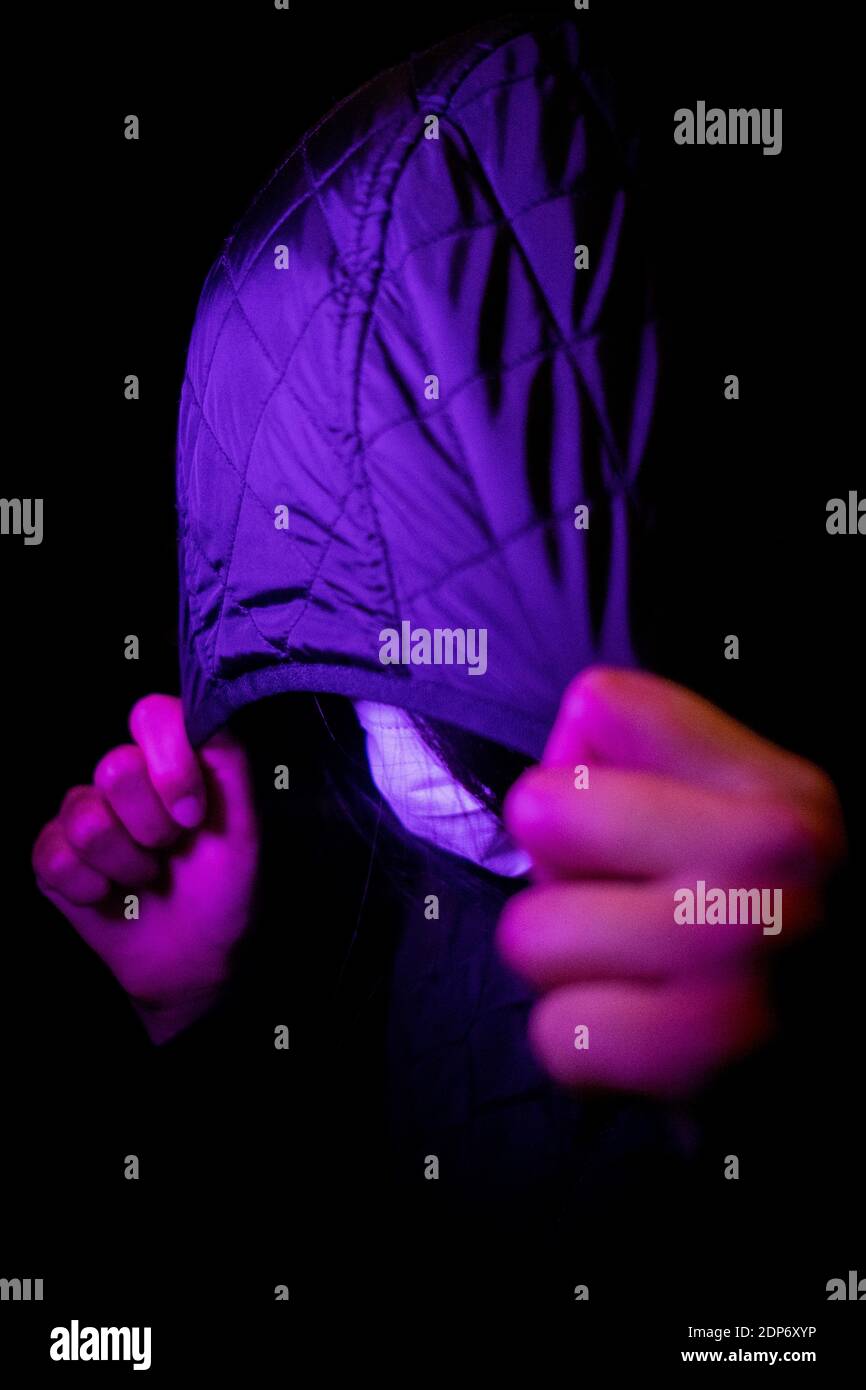 Portrait in the dark of a militant of the pro-democracy movement in ...