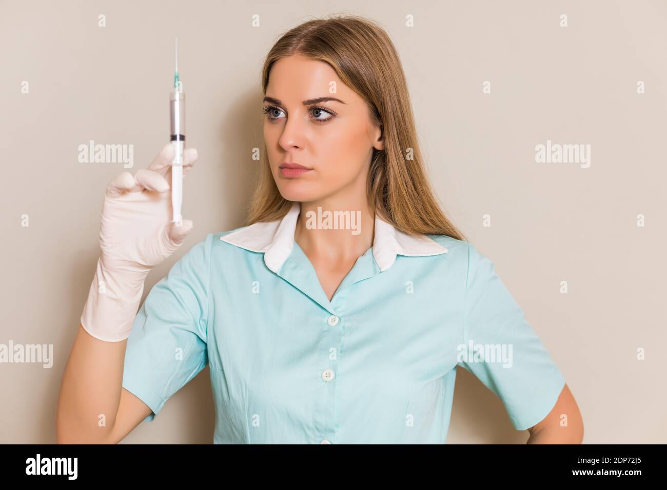 Portrait of medical nurse holding injection Stock Photo - Alamy