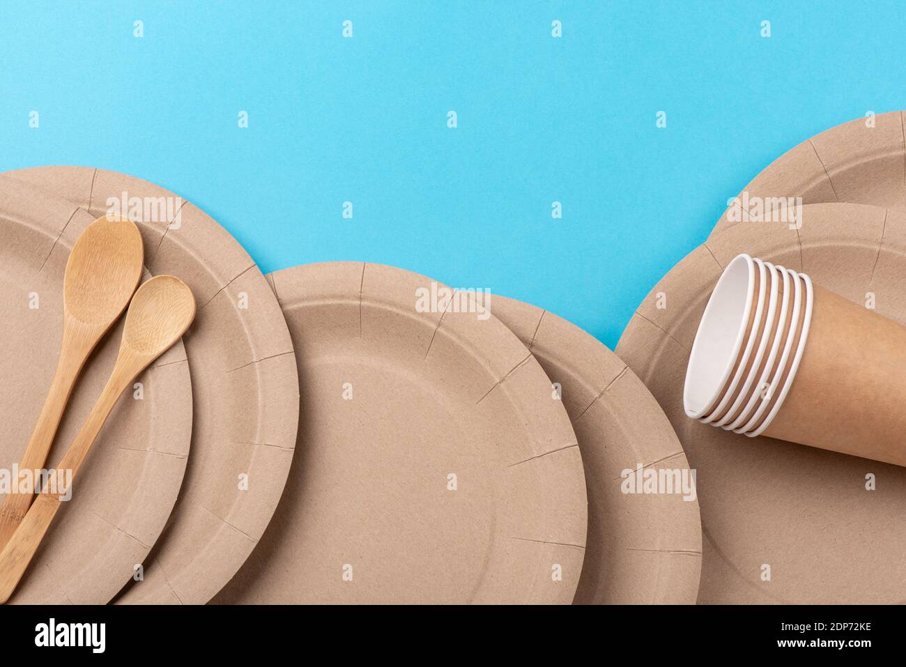 Eco-friendly biodegradable paper dishes on a blue background Stock ...