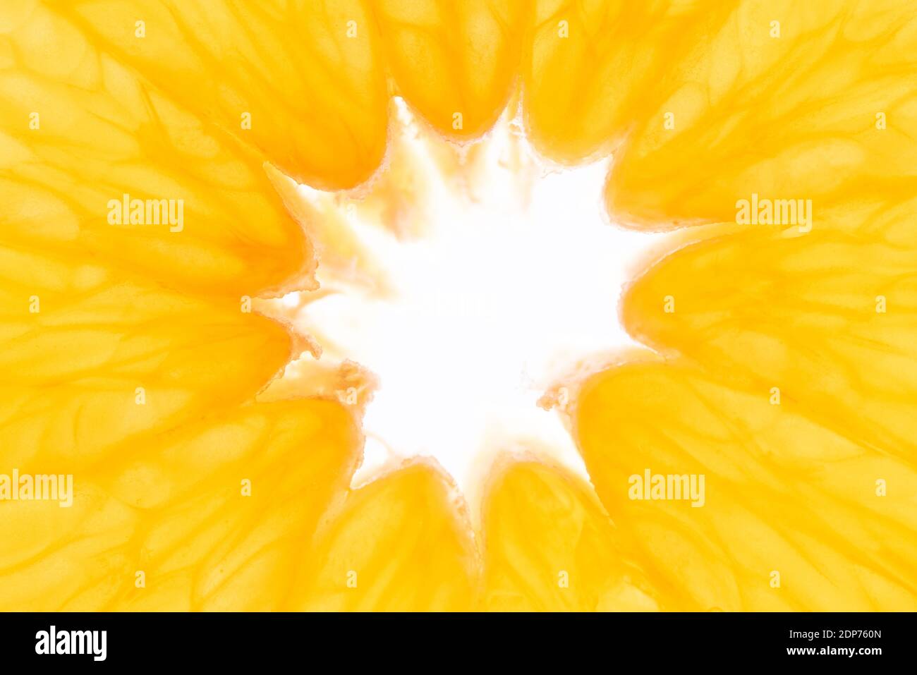 Macro photo of slices of ripe juicy orange with back light isolated on ...