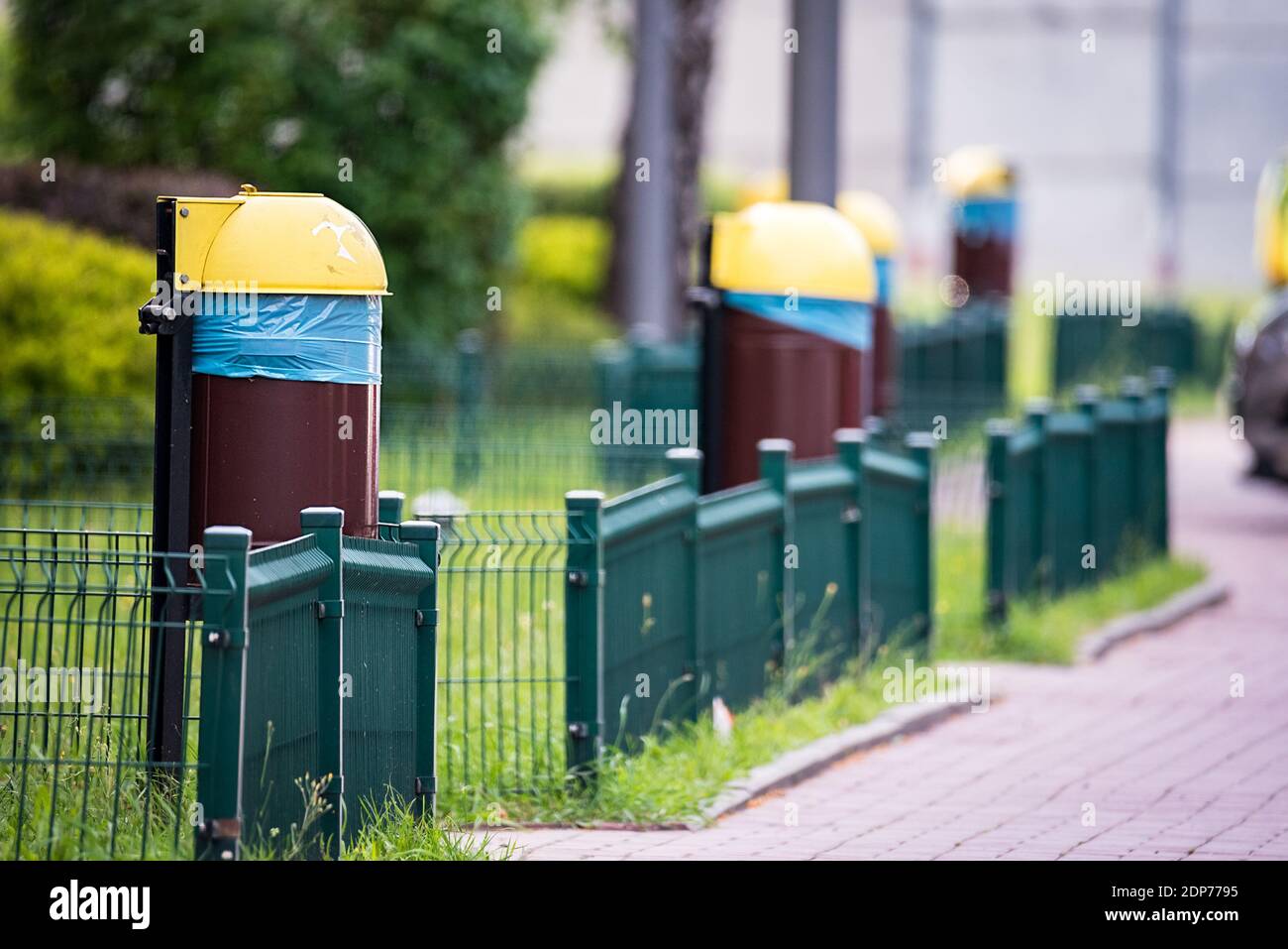 Litter bins on the sidewalk. Cleanliness in the city. Maintaining order ...