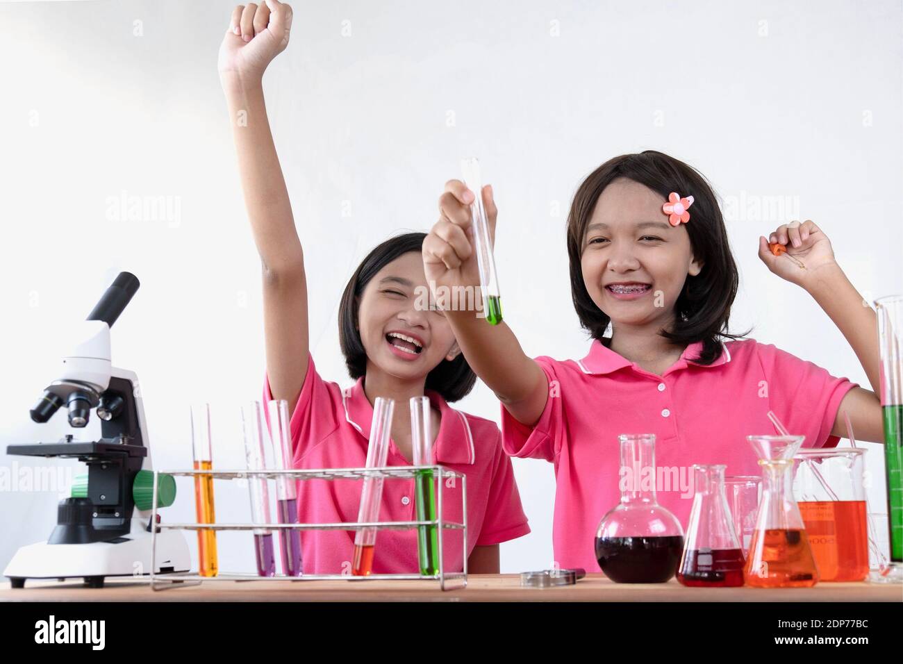 Two girls doing science experiment hi-res stock photography and images ...