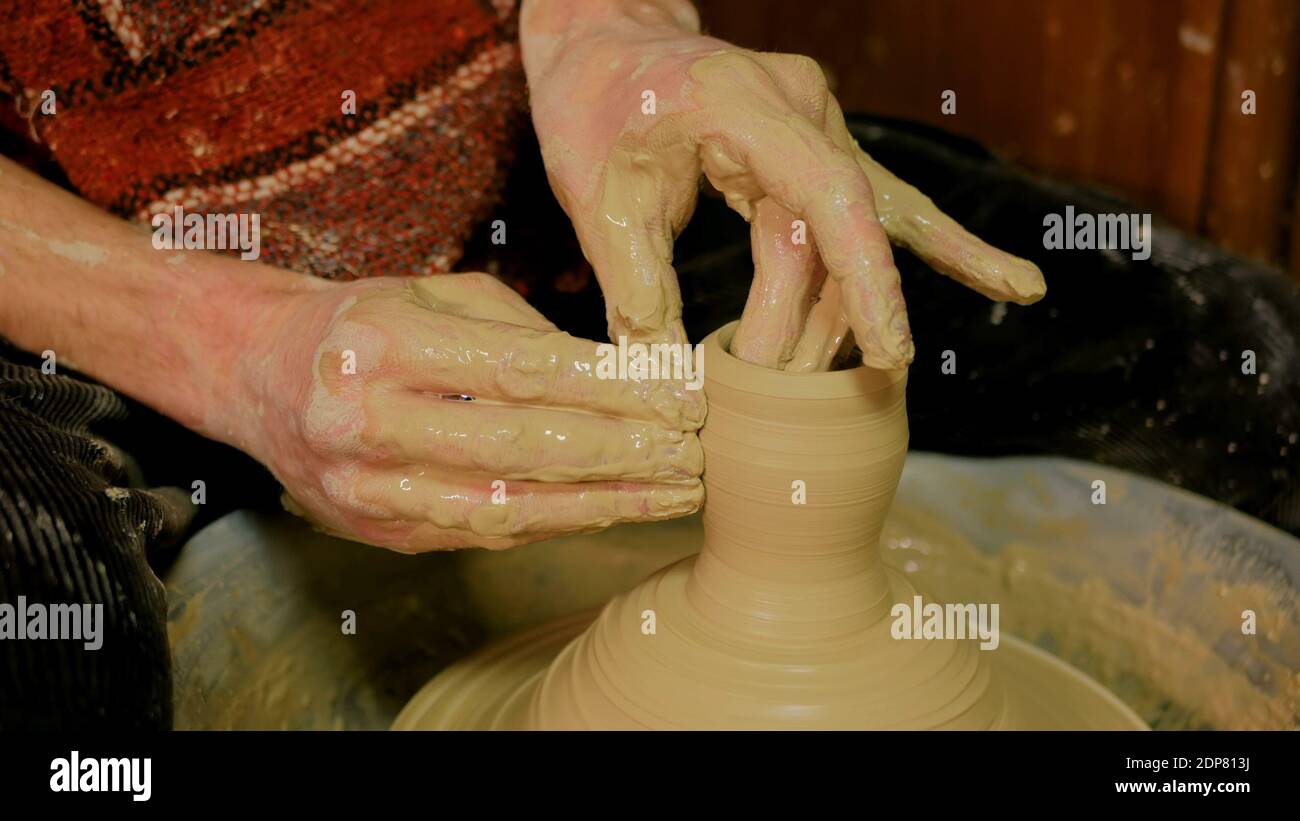 Professional male potter making mug hi-res stock photography and images ...