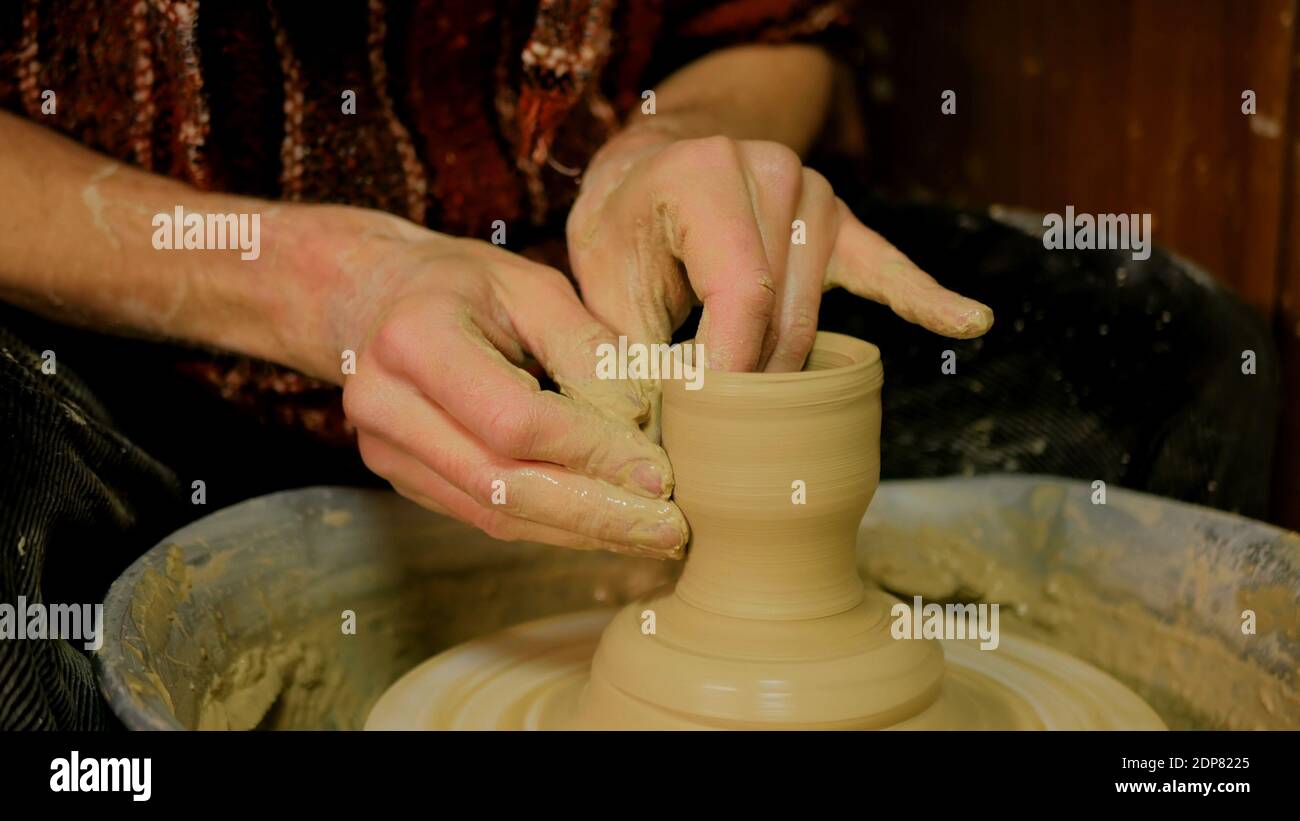 Professional male potter working in workshop Stock Photo - Alamy