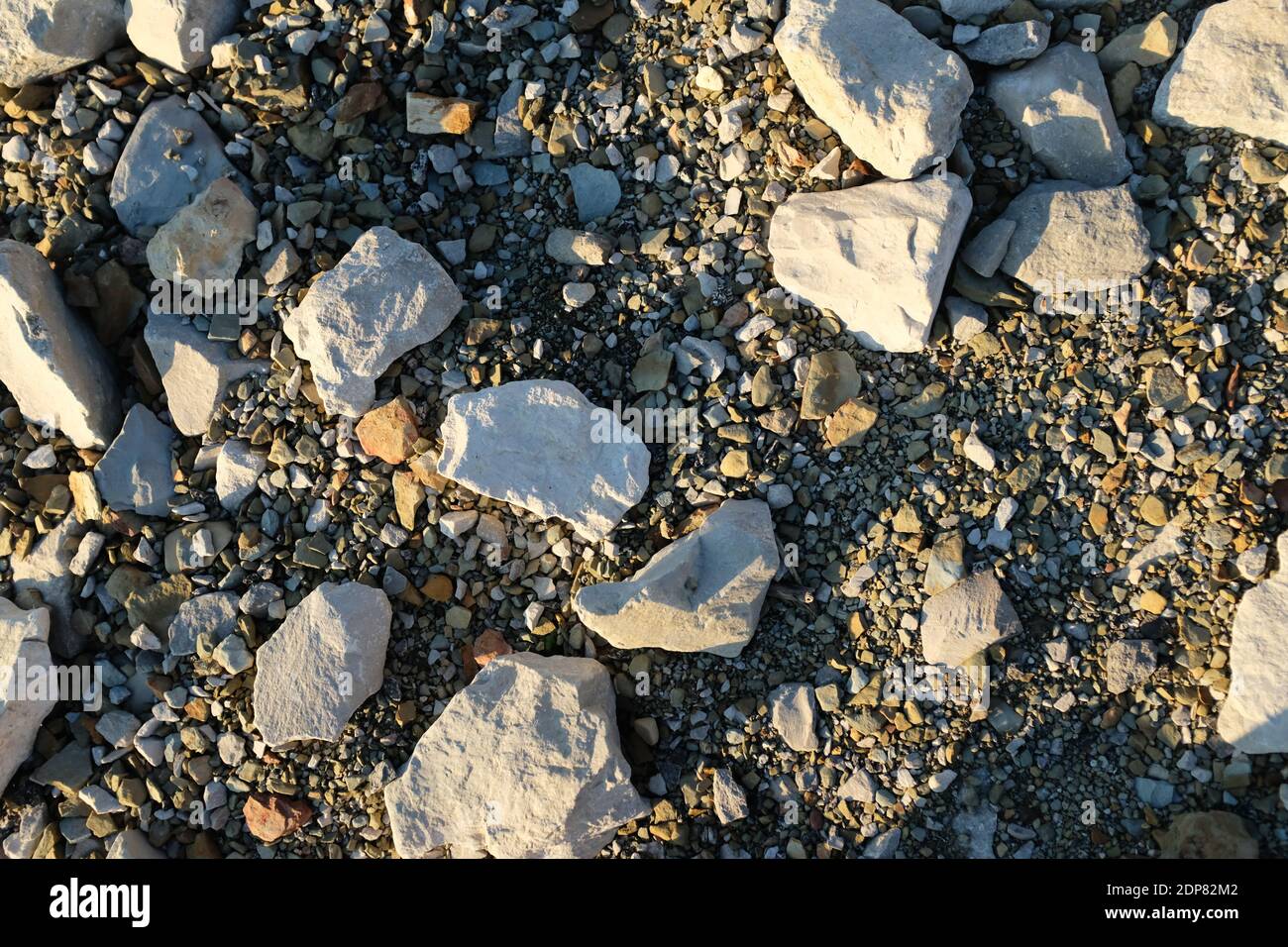 A top shot of various kinds of rocks on the side of a river in Kentucky ...