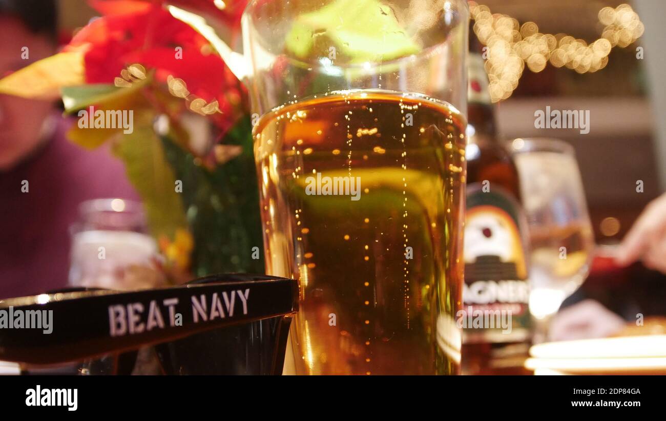 A glass of beer on a restaurant table Stock Photo - Alamy
