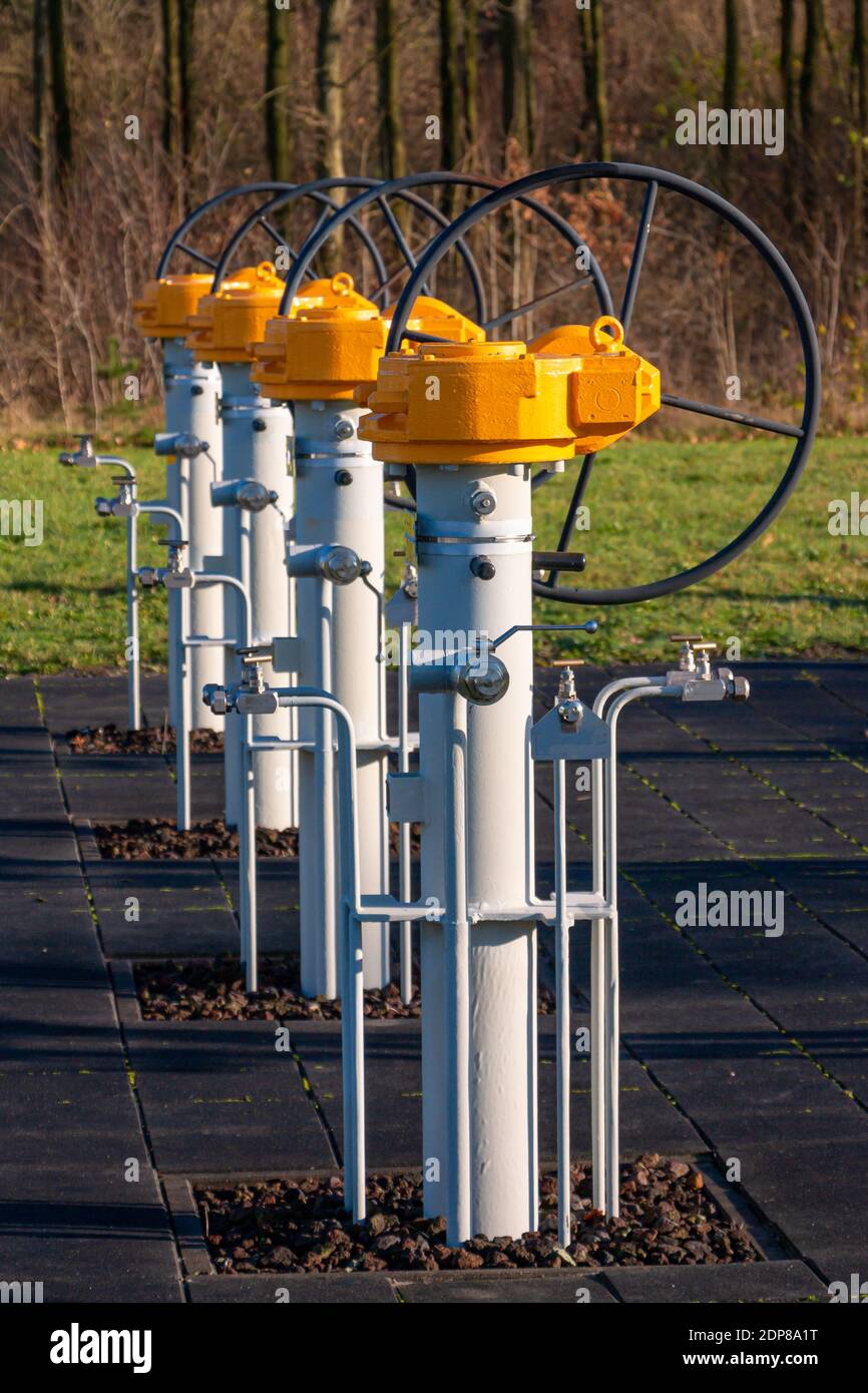 Hand operated industrial valves mounted on a pipe that can be opened ...