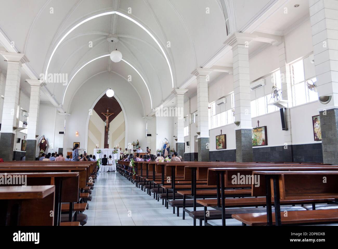 A wedding blessing in a catholic church, with a very beautiful building ...