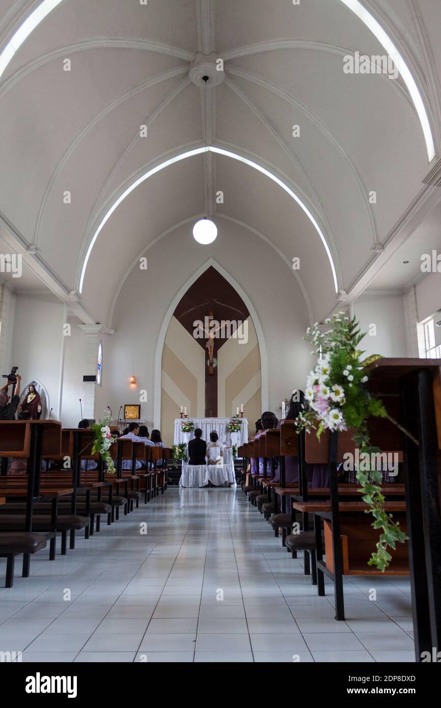 A wedding blessing in a catholic church, with a very beautiful building ...