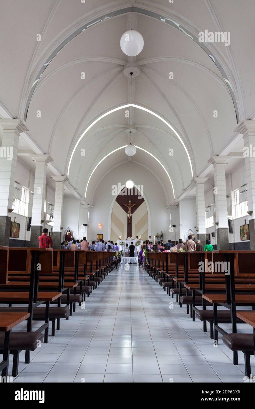 A wedding blessing in a catholic church, with a very beautiful building ...