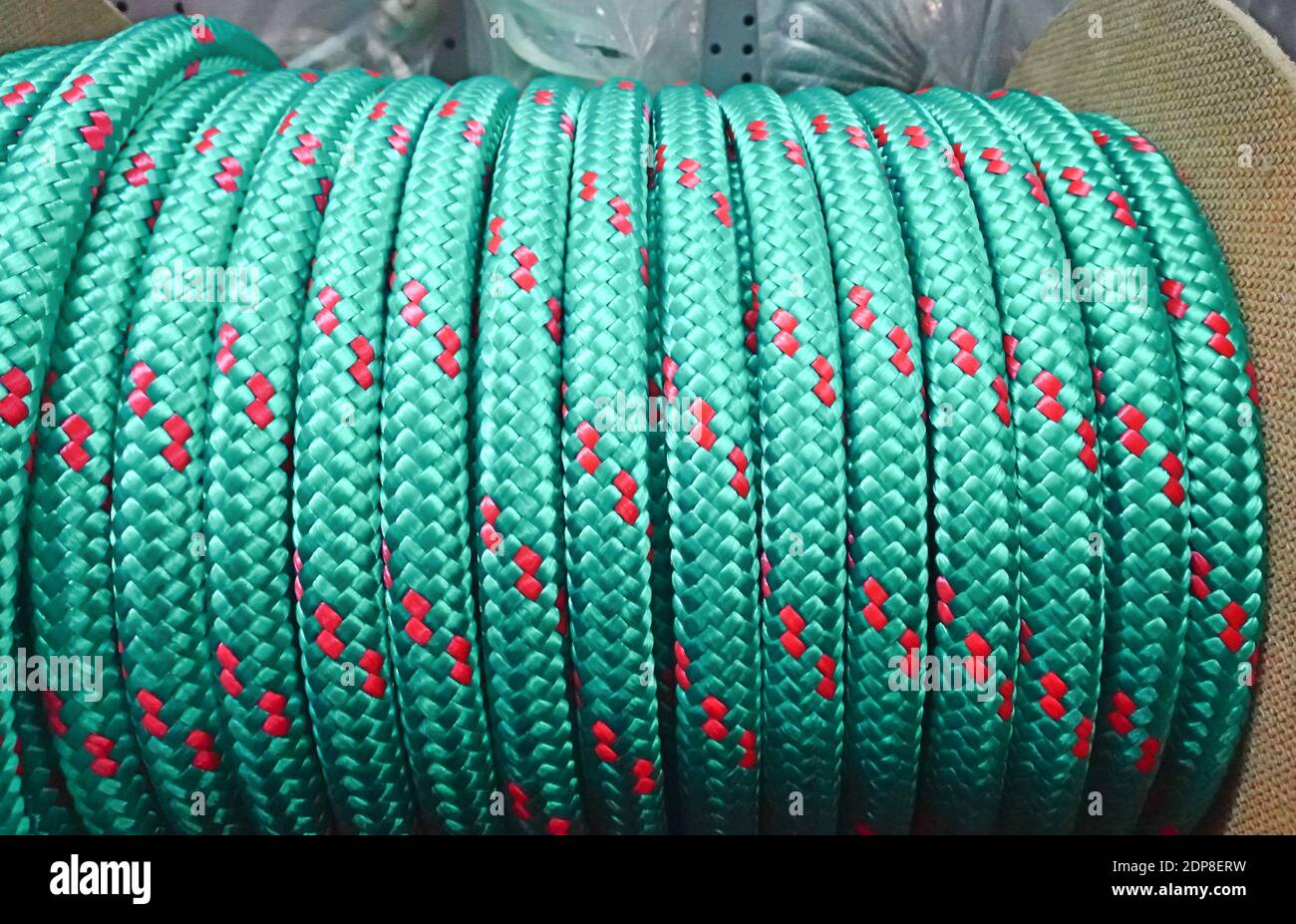Rolled green rope Stock Photo - Alamy
