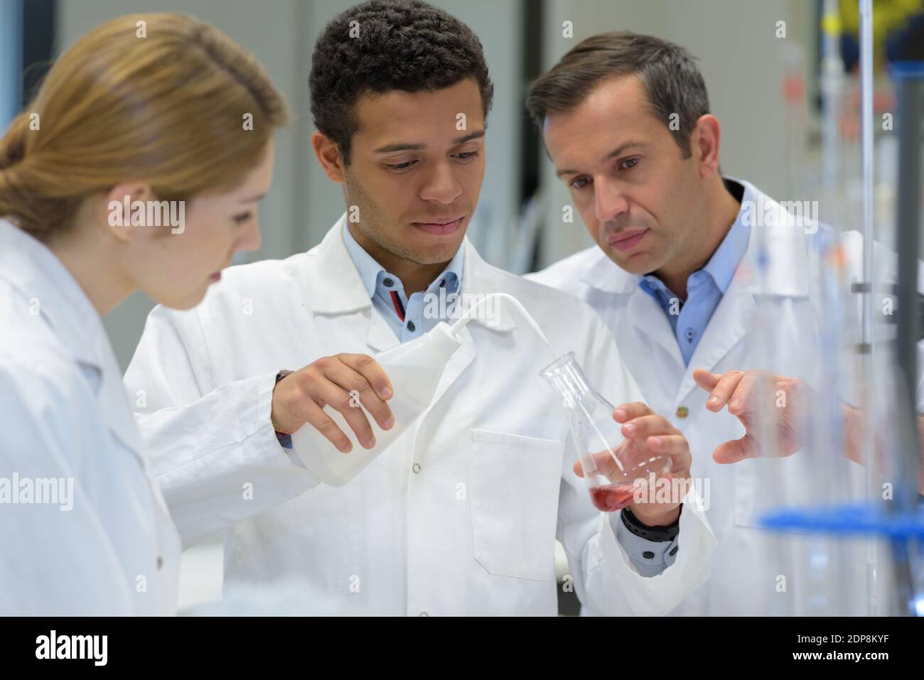 picture of a laboratory group testing a sample Stock Photo - Alamy