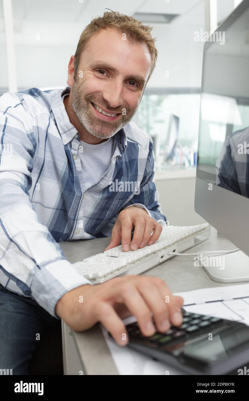 middle-aged man using a desktop computer Stock Photo - Alamy