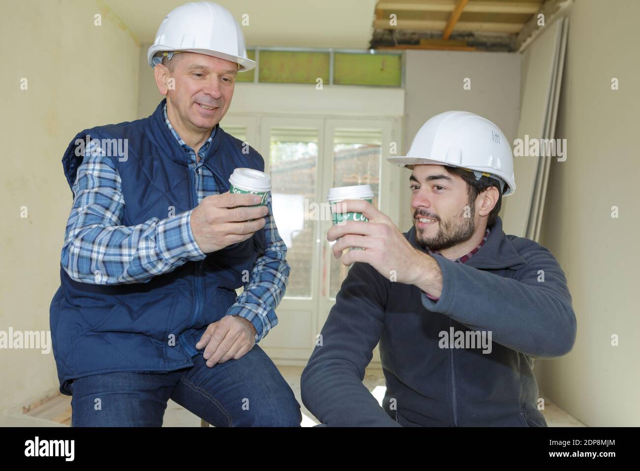 two men builders coffee break Stock Photo - Alamy