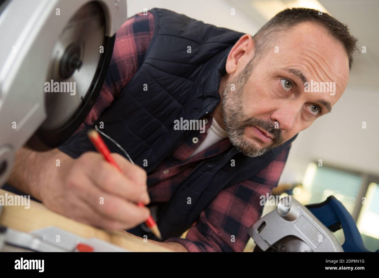man using industrial circular saw Stock Photo - Alamy