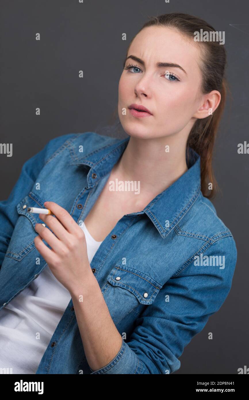 close up of woman smoking cigarette Stock Photo - Alamy