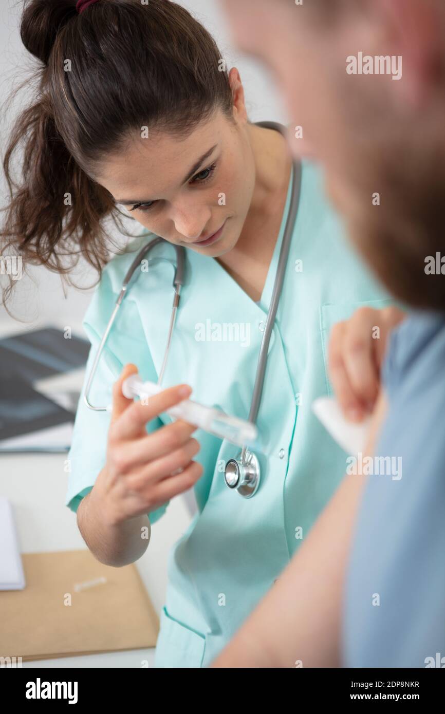 doctor giving male patient injection Stock Photo - Alamy