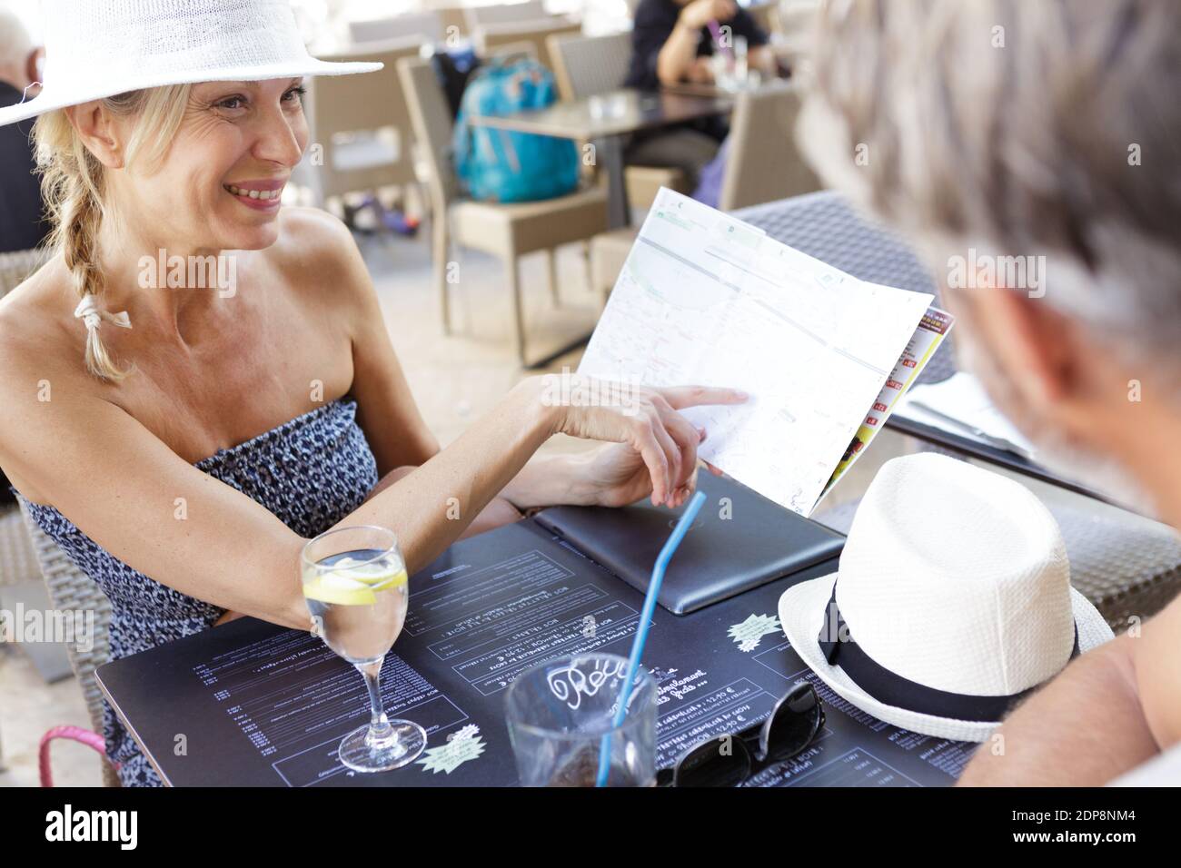 nice happy woman pointing at the restaurant menu Stock Photo - Alamy