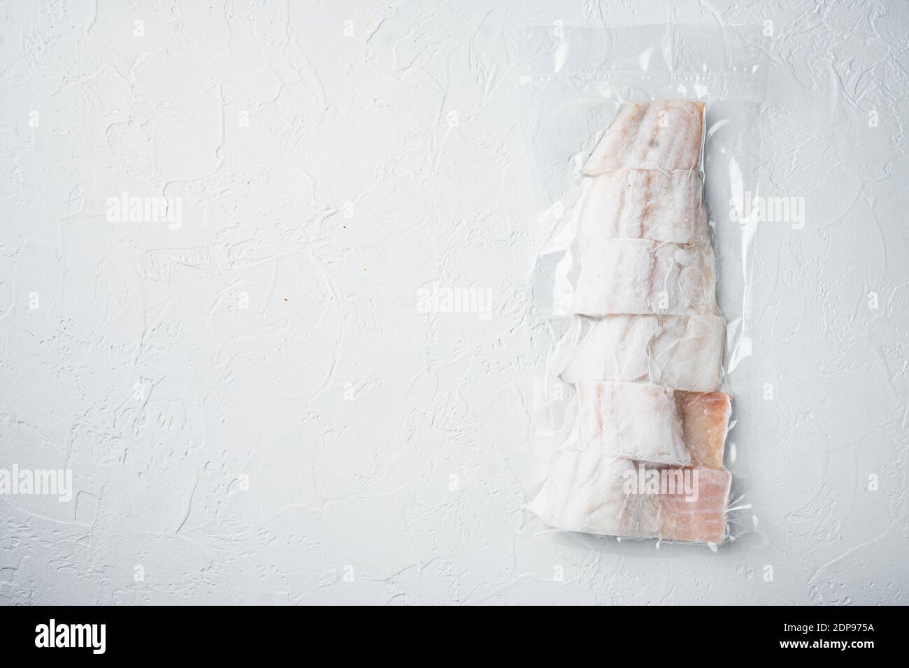 Haddock white fish fillet in plastic market package, on white ...