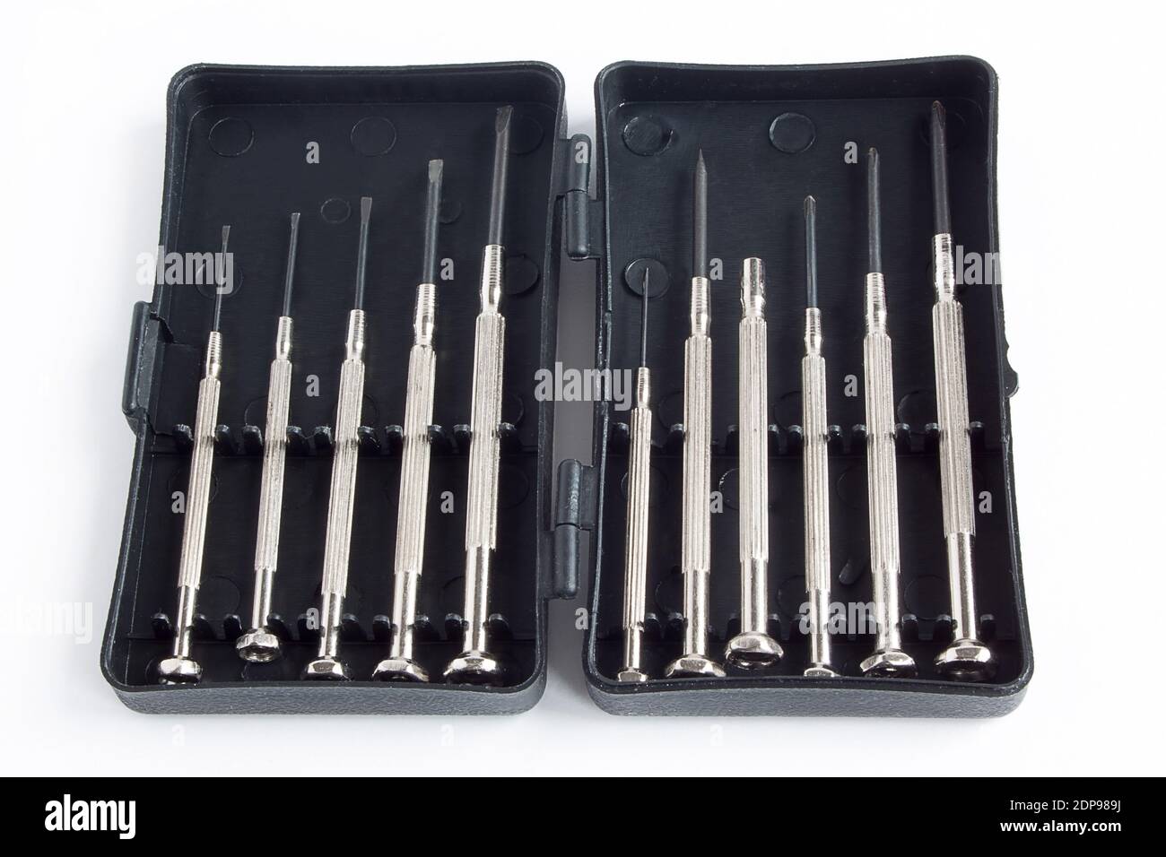 Set of clock screwdrivers in a black case. Isolated on a white ...