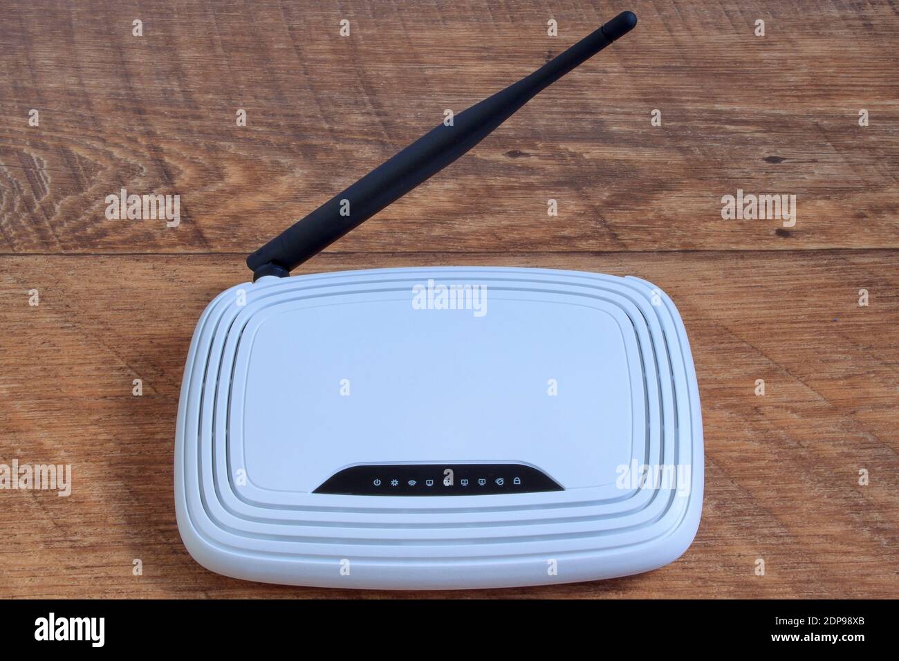 Wi-Fi wireless router on brown wooden table. Isolated object Stock ...