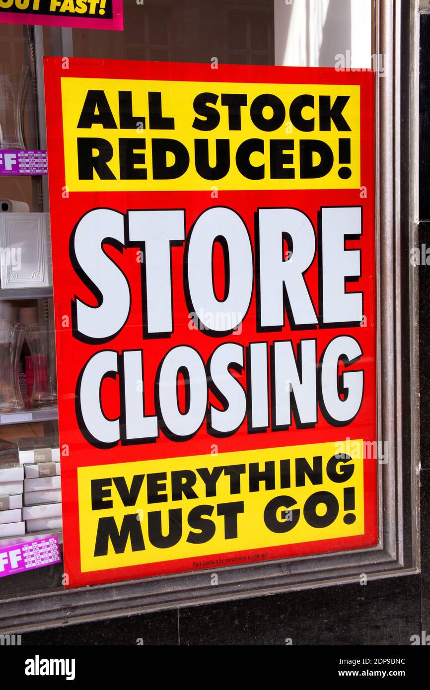 Store closing poster in a window of a bankrupt shop advertising all ...