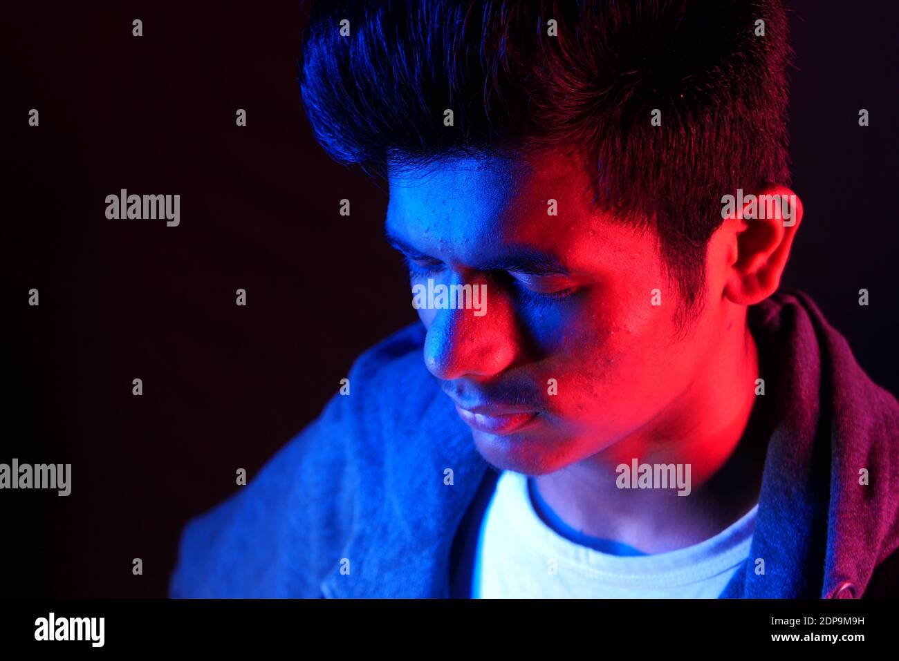 sad and depressed man looking down in dark Stock Photo - Alamy