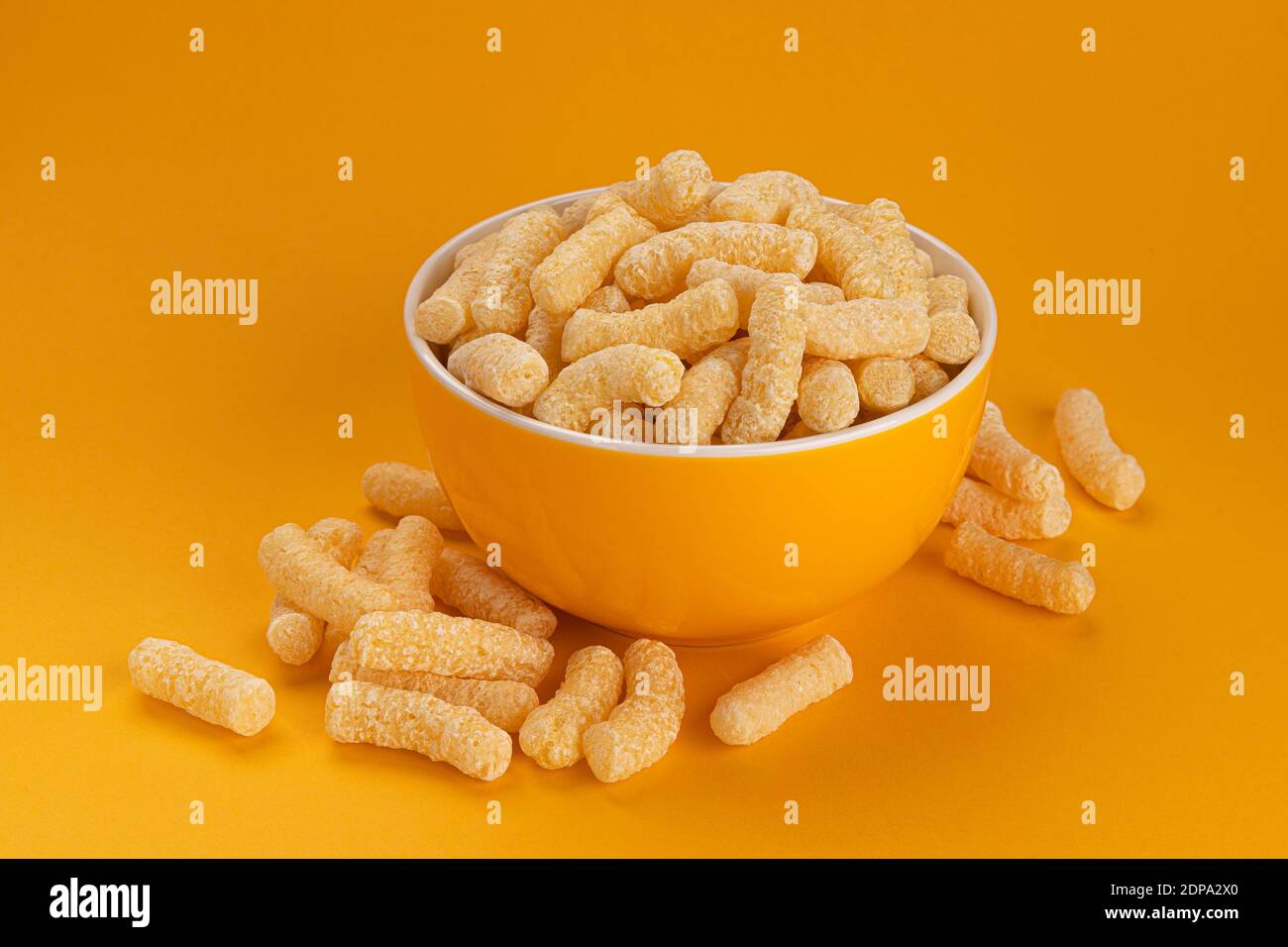 Sweet corn sticks isolated on yellow background Stock Photo - Alamy