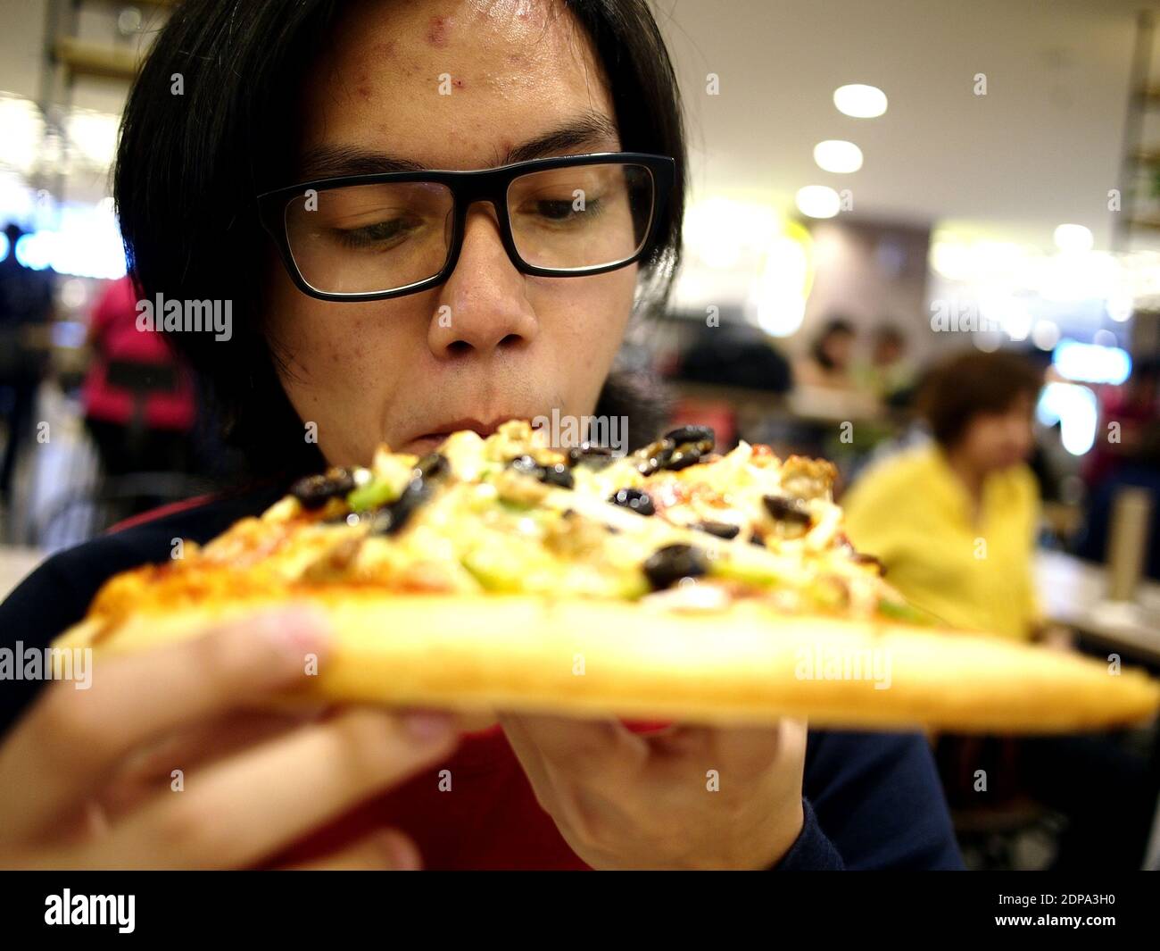 close-up-of-teenage-boy-eating-pizza-stock-photo-alamy