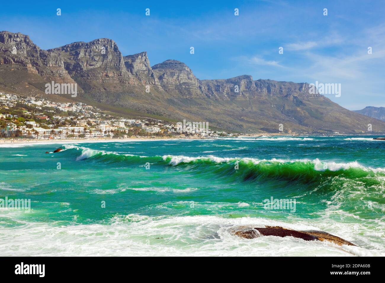 A beautiful shot of turquoise wavy waters in Cape Town, South Africa ...