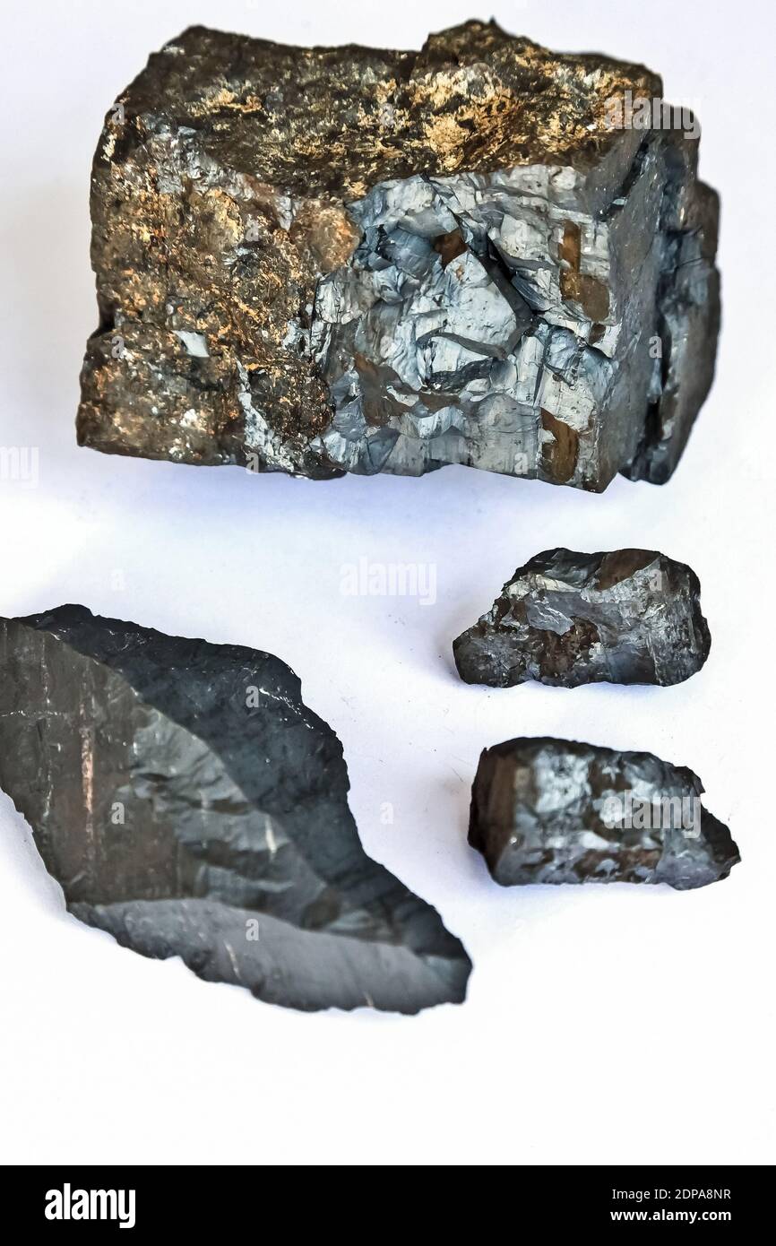 A vertical isolated shot of manganese ores on white background Stock ...