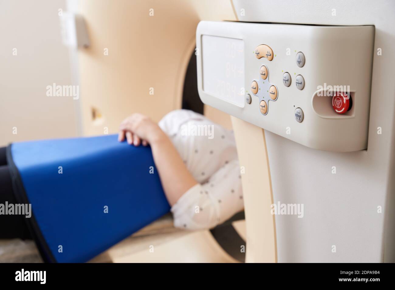 Woman going through a Computerized Axial Tomography CAT scanner. Scan ...
